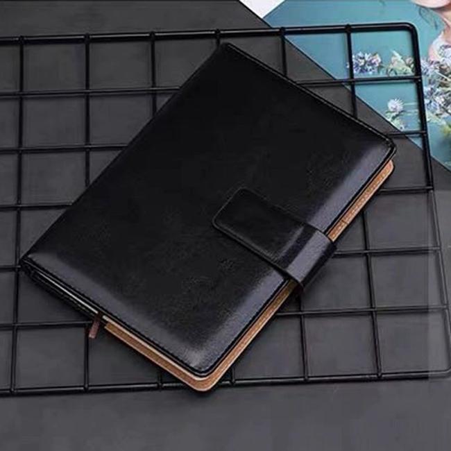 Black PU leather notebook placed on a dark grid wire background for commercial wholesale display
