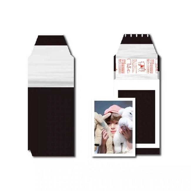 Monochrome black and white peel-apart card cover alongside a printed portrait photo card