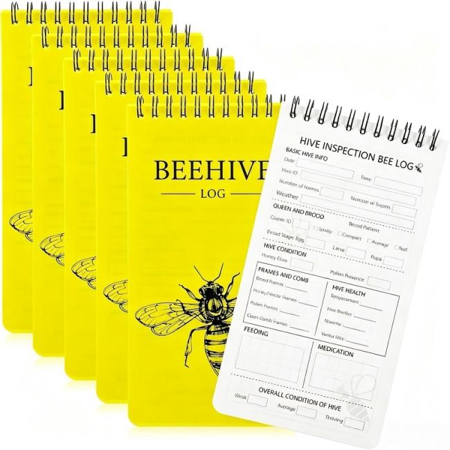 Multiple custom beekeeping log books in a row showcasing yellow covers and pre-printed inspection sheets for wholesale buyers