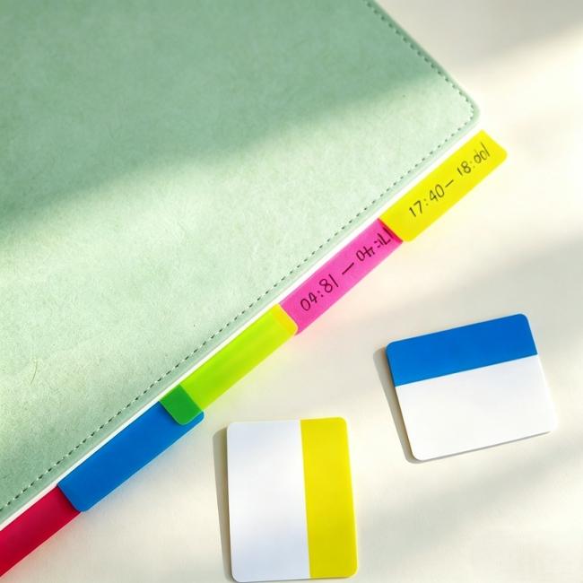 Repositionable index tab sticky notes used in office filing folders