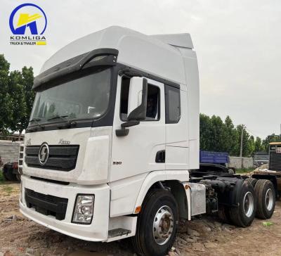 Cina Uomo 16 tonnellate asse posteriore riduttore a due fasi Shacman trattore camion testa per rimorchio in vendita