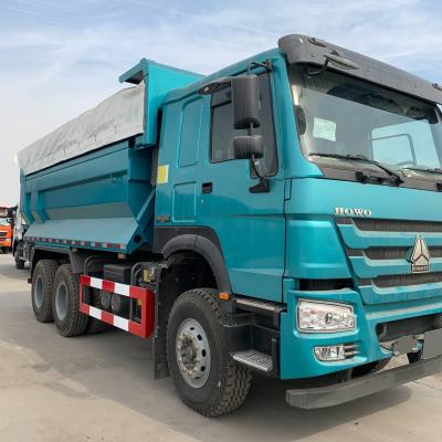 China GCC-gecertificeerde gebruikte Sino Truck HOWO 6X4 Dump Truck met tralies en 1200r20 banden Te koop