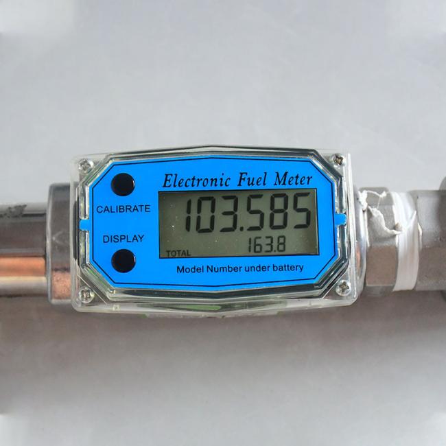 Close-up view of the digital flow meter and nozzle assembly