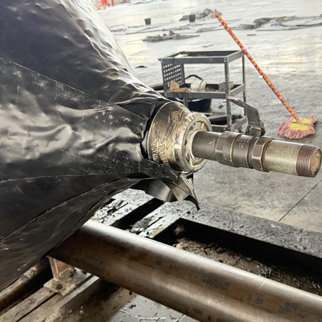 Close-up view of marine airbag construction showing reinforced rubber and cord layers