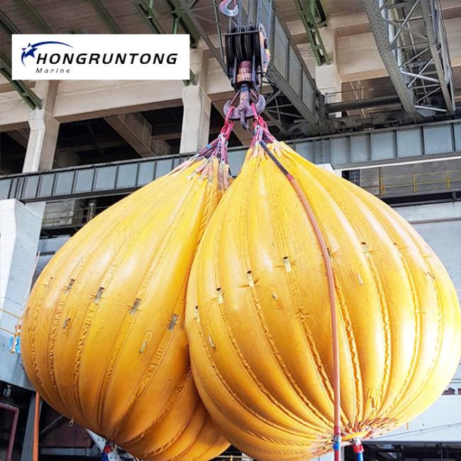 PVC-coated load testing water bag connected to lifting rigging during crane inspection