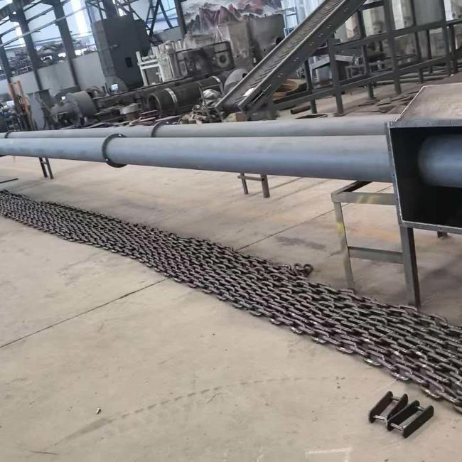 Automatic Enclosed Tube Chain Conveyor System in industrial setting