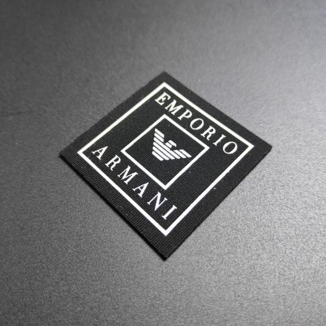 Woven iron-on patch with fine detailed design