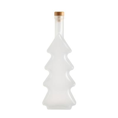 Cina 500 ml di bottiglie di vetro ghiacciato a forma di albero di Natale per vino, vodka, bevande e design in vendita