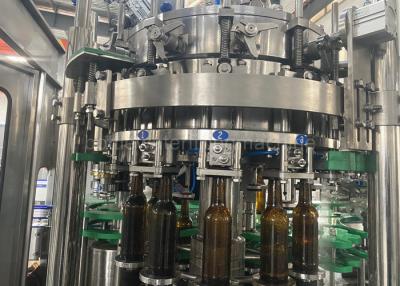 中国 250mlガラス ビン ビール満ちるおおう機械、ガスの冷たい飲み物のびんの充填機 販売のため