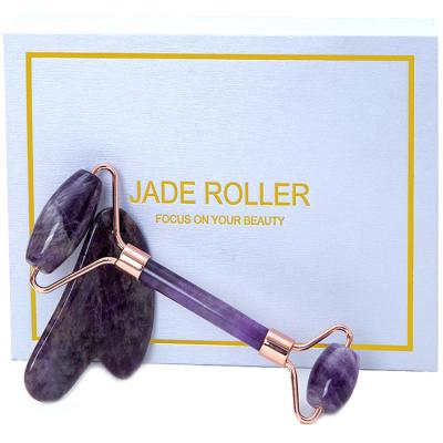 Cina Massaggiatore Faciale Rulli di Giada viola e Quarzo Rosa Gua Sha Set per drenaggio linfatico in vendita