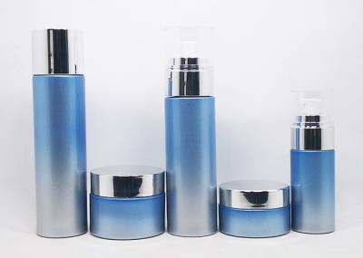 Cina 100 ml di cosmetico di vetro che imballa stampa uv di Skincare della bottiglia blu della lozione in vendita