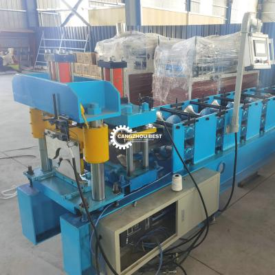 Chine Boîte de vitesse en acier Ppgi Ridge Cap Roll Forming Machine de bureau à cylindre de profil à vendre