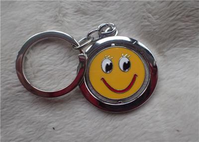 Cina Portachiavi color argento Regali promozionali personalizzati con faccia gialla sorridente rotabile in vendita