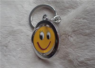 Cina Portachiavi color argento Regali promozionali personalizzati con faccia gialla sorridente rotabile in vendita