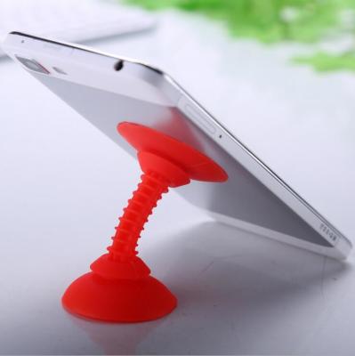 China El doble multifuncional del silicón echó a un lado soporte del lechón de la ventosa para el teléfono celular y la devanadera para los accesorios autos en venta