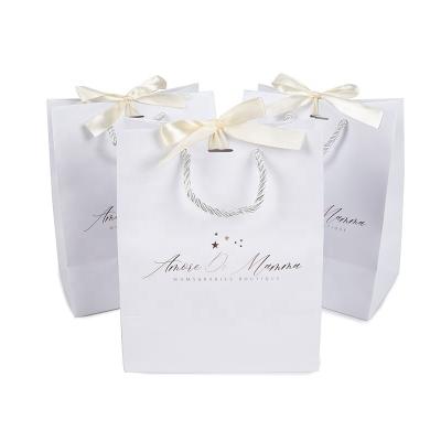 China Creatrust Custom Gift Paper Bag Handle Paper Bags Brand Logo Luxury Boutique Shopping White Kraft Paper Customized CMYK Accept for sale