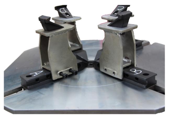XT-209 Tire Changer operational view demonstrating rim clamping mechanism