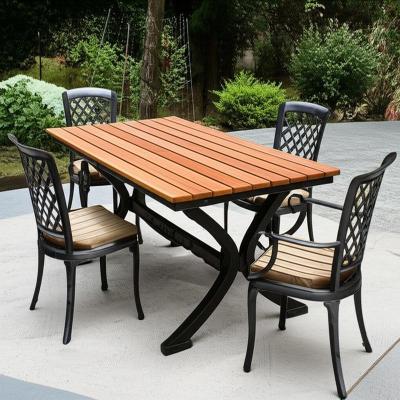 China Create a Rustic Outdoor Setting with Cast Iron Table And Chairs in Natural Wood and Matte Finish for sale