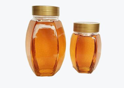 Cina Caratteristica di vetro esagonale ovale di Honey Jars Transparent Color Moistureproof in vendita