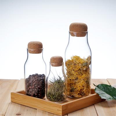 Cina 150 ml di vetro decorativo di 330 ml imbottigliano/barattoli di vetro di stoccaggio con Cork Lid in vendita