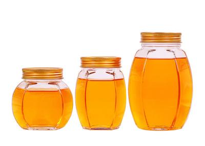 Cina Coperchio dorato di Honey Jars With Twist Off dell'inceppamento della bottiglia di vetro di vetro di esagono in vendita