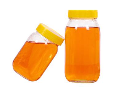Cina Chiaro Honey Jars Hexagon Glass Jar rotondo con i coperchi neri 500ml 1000ml in vendita
