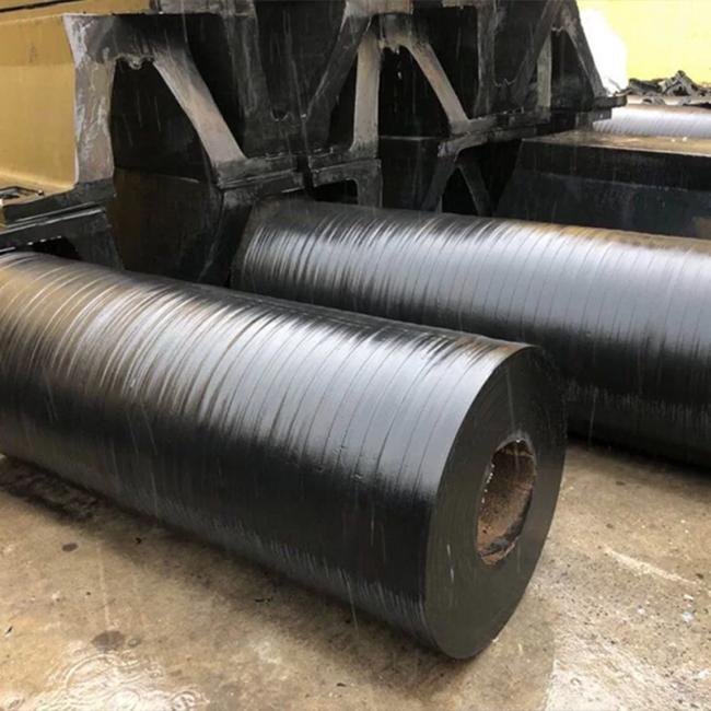 Industrial view of cylindrical rubber fender installation