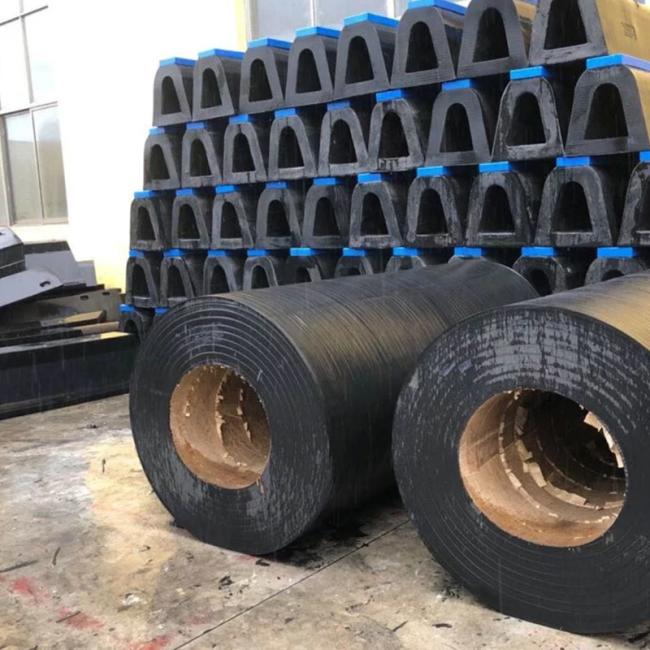 Close-up view of cylindrical fender surface and mounting