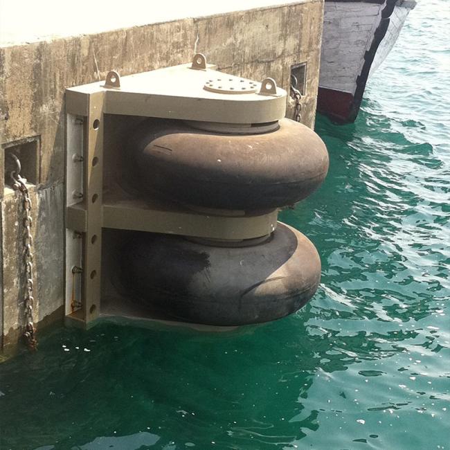 Roller Fender installation showing complete assembly with steel support structure and mounting hardware