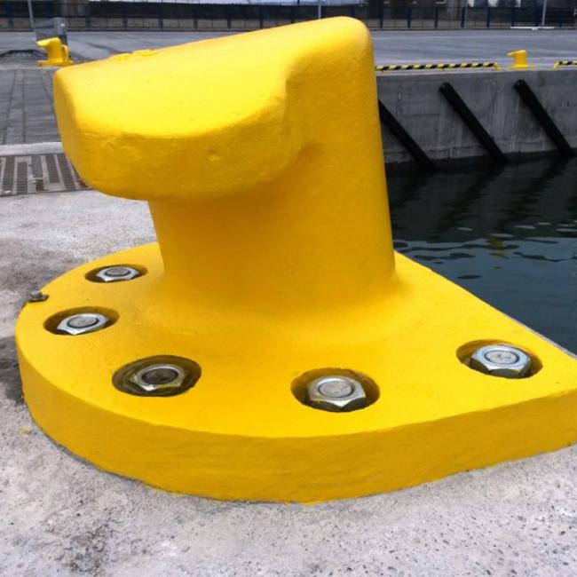 Mooring bollard surface treatment and mounting detail