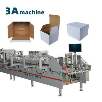 Cina Imballaggio in cartone Macchina adesiva automatica per cartelle QT**900YG-2 con 9,9M*1,2M*1,3M Dimensione in vendita