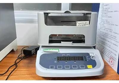 Density determination tester for material consistency