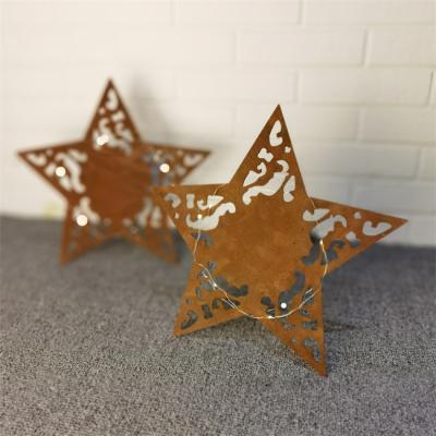 中国 Cortenの星形の鋼鉄家の庭のためのクリスマスの装飾を飾り金具 販売のため