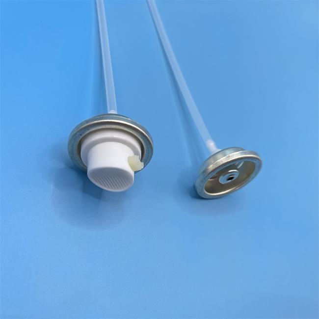 Close-up view of female aerosol glue spray valve showing nozzle details