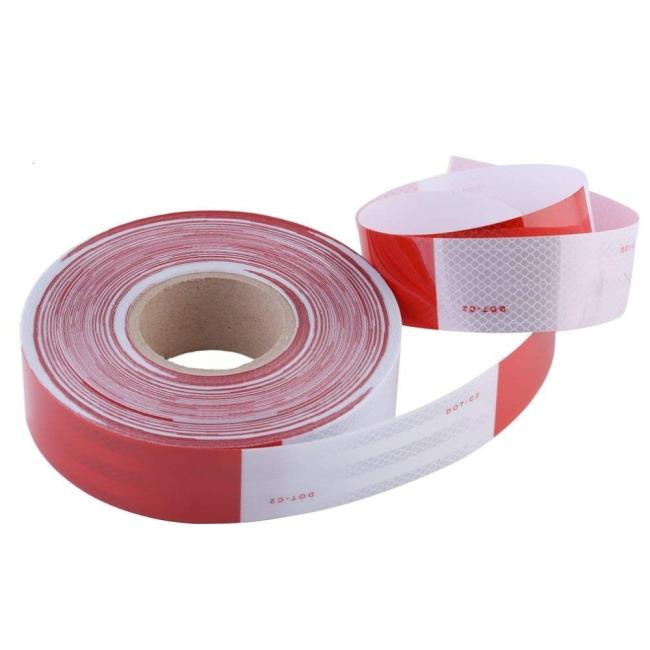 Close-up of DOT reflective tape adhesive backing and flexible construction