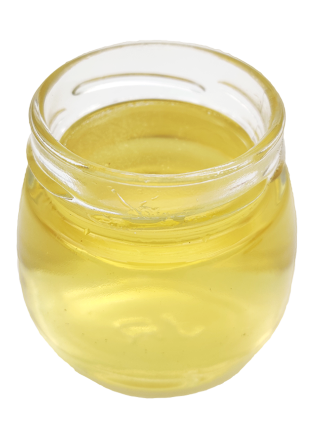Wholesale poly flower honey in a clear jar showing its natural golden color and texture