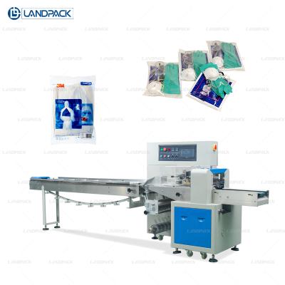 Cina Fully Automatic Protective Suit Packing Machine Protective Clothes Flow Wrap Machine in vendita