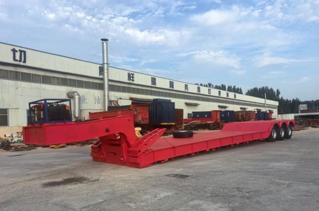 Rear perspective of Low-Bed Semi-Trailer showing loading platform