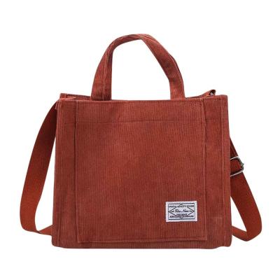 China Bolsas de compras de lona com fecho de zíper alça ajustável estilo simples à venda