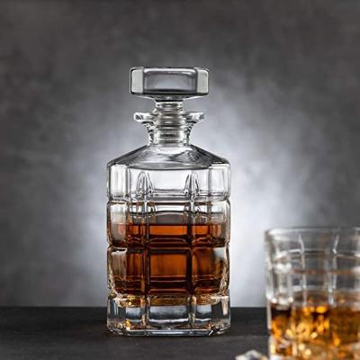 Cina Tappo di vetro rotondo Bottiglia di whisky di bourbon per cosmetici Disegno inciso Capacità 30 oz in vendita