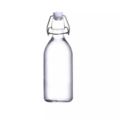 Cina Bottiglia di 600 ml rotonda di vetro con tappo Carafe Swing Top Bottiglia di birra Kombucha Bottiglia di bevanda in vendita