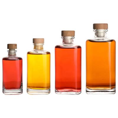 Cina Vetro rotondo Vino liquoroso Whisky Tequila Vodka Bottiglia con sughero 100ml 200ml 250ml 300ml in vendita
