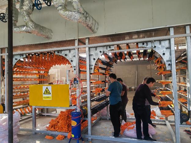 Close-up view of PVC gloves dipping machine components and printing system