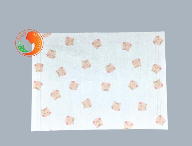 Disposable changing mat in use