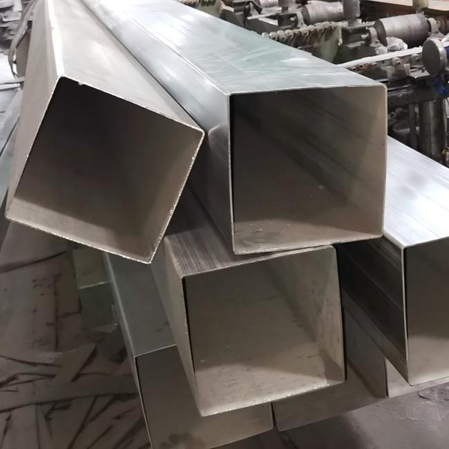 Large stainless steel square hollow section stock Large size stainless steel square tubes stacked in factory warehouse