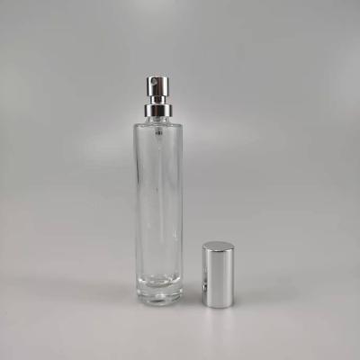 Cina ODM OEM Stampa bottiglia di profumo in vetro rotondo da 35 ml con spruzzatore a pompa d'argento dorato in vendita
