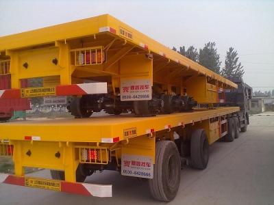 Cina Materiale d'acciaio a base piatta del rimorchio Q234 del contenitore della pittura gialla da vendere (sospensione meccanica/airbag/carrello ferroviario facoltativa) in vendita