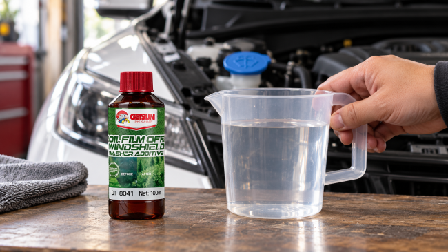 GETSUN GT-8041 bottle beside clean water prepared for dilution near a washer reservoir