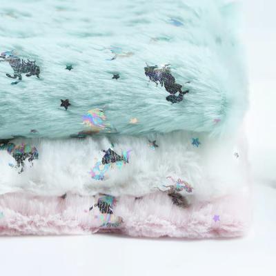 China Recycled SHAOXING Factory Supplier Bunny Hair Foil Fabric Two-Color Unicorn Pattern Super Soft Plush Fleece Fabric for sale