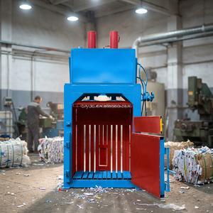 Hydraulic baling machine processing agricultural biomass materials